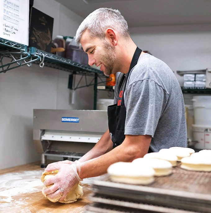 Craftsmanship in action—each donut shaped by hand with care that you can taste in every bite.