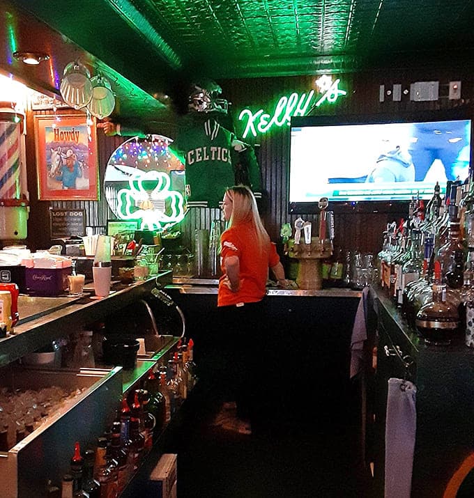 The bar area buzzes with energy as patrons enjoy the game, friendly conversation, and drinks served by staff who remember your usual order.