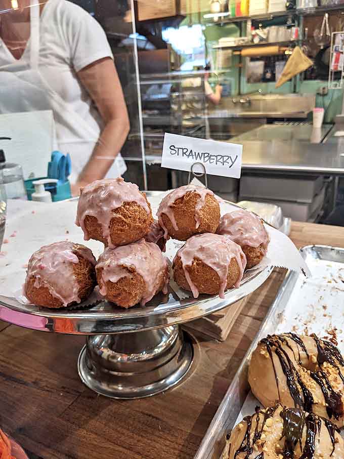 Strawberry donut holes with their pink glaze glisten like edible jewels &ndash; small in size but mighty in flavor impact.