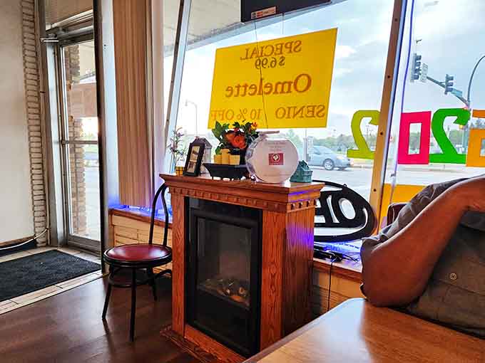 That electric fireplace adds cozy ambiance without the smoke, perfect for warming up during Minnesota winters.