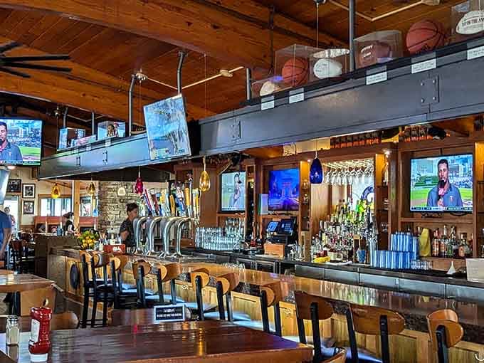 The bar area offers prime seating for game day with multiple screens and a well-stocked drink selection.