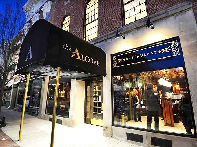 As evening falls, The Alcove's exterior glows with promise, a beacon for those seeking culinary excellence in Mount Vernon.