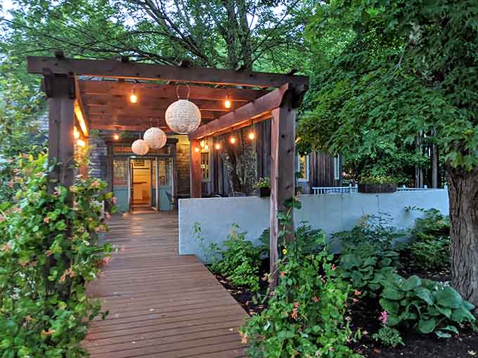 When the weather cooperates, this outdoor deck becomes the best seat in the house, surrounded by greenery and strung with lights for magical evening dining.