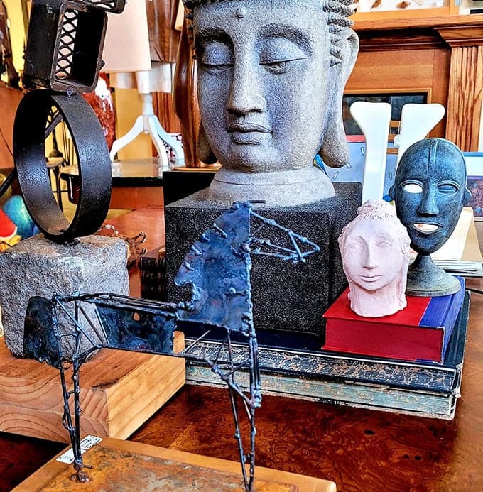 Buddha meets modern art in this eclectic display, because why choose one aesthetic when you can embrace them all?