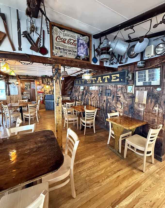 Another angle of the charming interior reveals more maritime treasures hanging from the ceiling and walls, creating an authentic coastal atmosphere throughout.