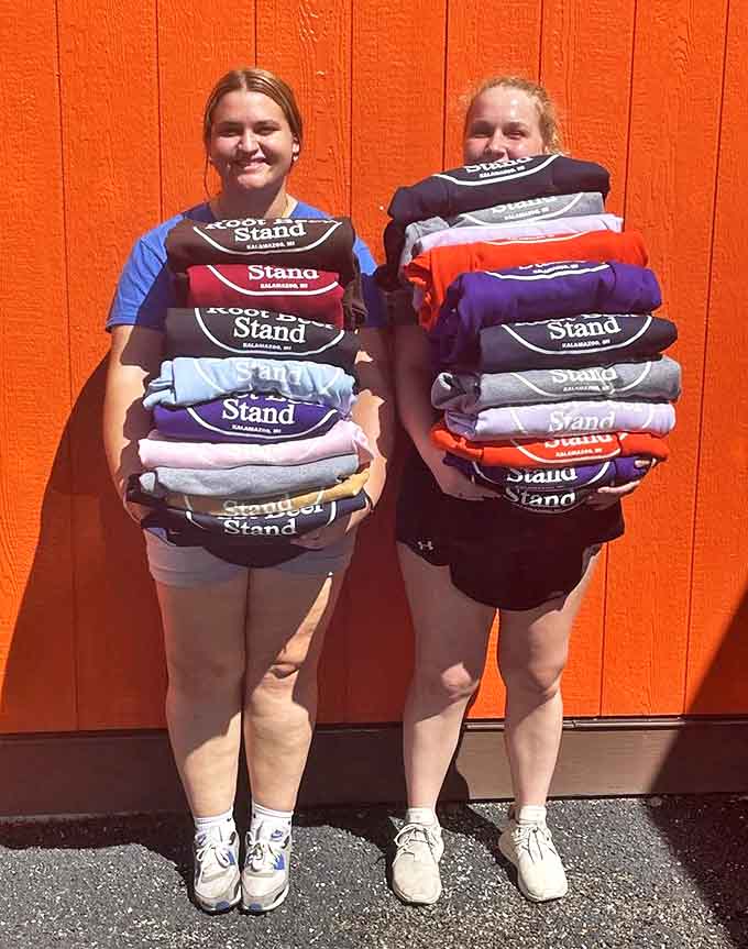 The Root Beer Stand merchandise proudly displayed by staff &ndash; because when food becomes this legendary, people want to wear the t-shirt.