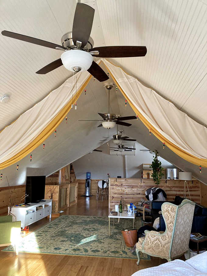 The loft accommodation above the winery combines rustic charm with cathedral ceilings, creating a wine-lover's dream overnight escape.