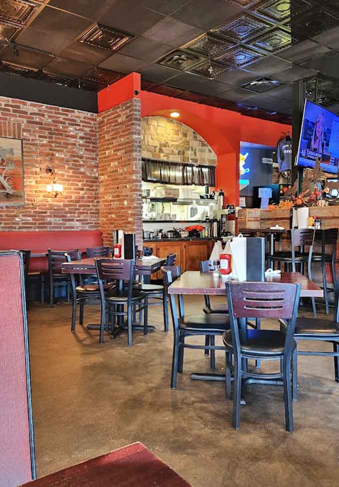 Exposed brick and warm lighting create an inviting atmosphere where sports fans and food lovers coexist in perfect harmony together.