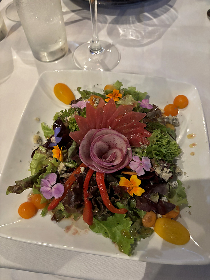 Garden on a plate! This vibrant tuna salad, adorned with edible flowers, demonstrates why Vermont's brief growing season produces such intense flavors.