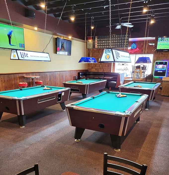 Pool tables under hanging lights create the perfect spot to work off your breakfast, assuming you can move after eating those portions.