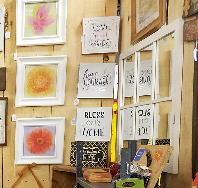 Inspirational wall art and delicate floral prints offer a softer counterpoint to the vintage tools and collectibles found elsewhere in the market.