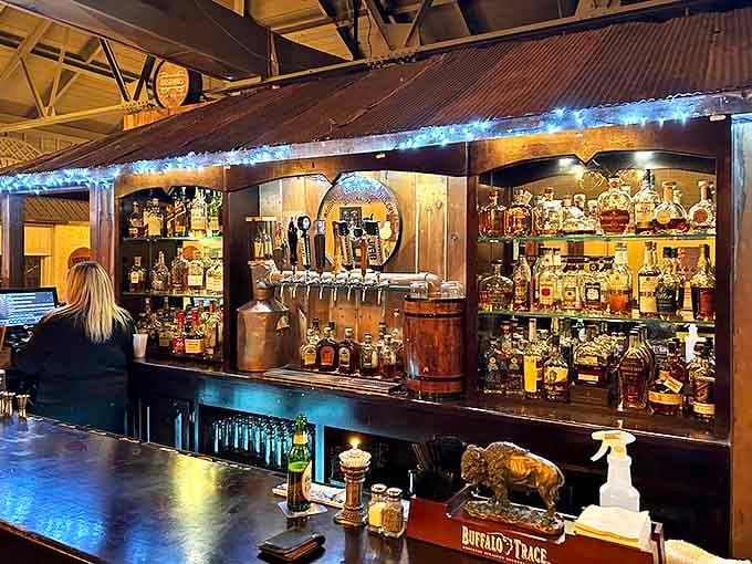 Not just a place to order drinks, but a shrine to automotive history where the wooden counter gleams like a freshly waxed classic car hood.