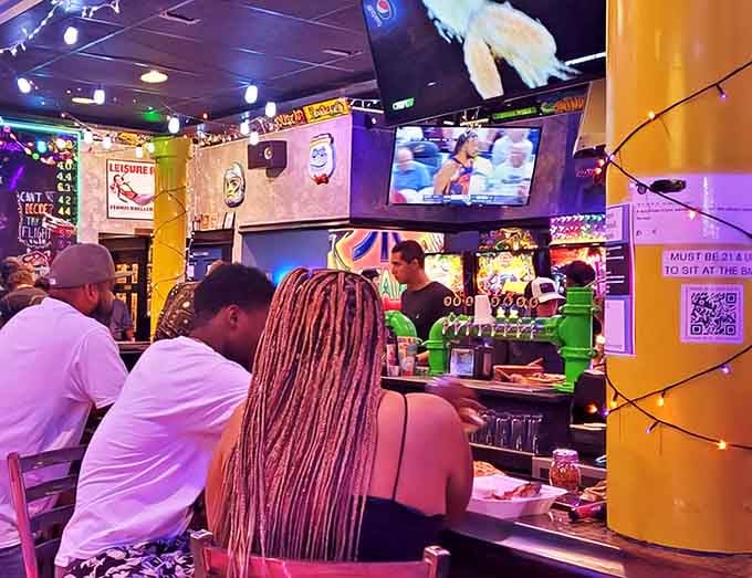The bar area serves as command central, where gamers refuel with craft beers while watching sports on screens between rounds of Skee-Ball.