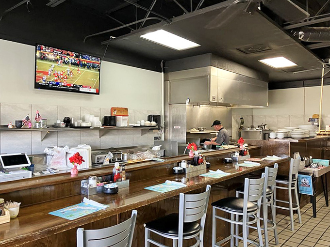 The bar area offers front-row seats to the kitchen action, where breakfast dreams become delicious reality.