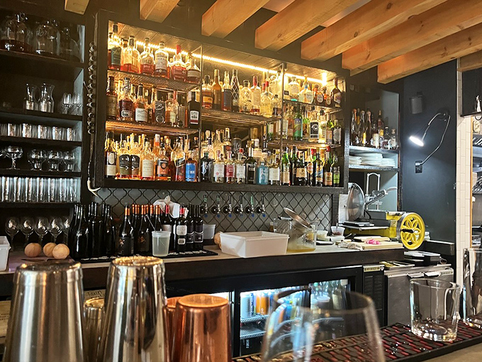 Bottles gleam like jewels behind the bar, where mixologists craft cocktails with scientific precision and artistic flair. The perfect liquid companion to your brunch adventure.