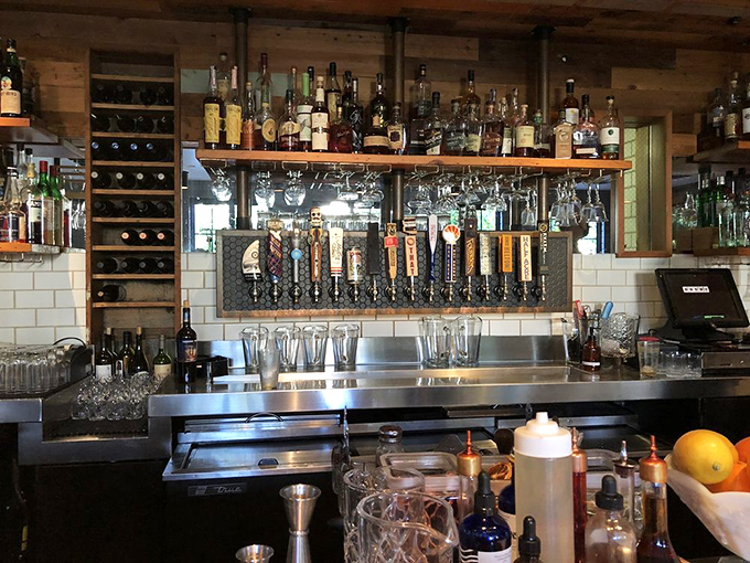 The bar beckons with bottles arranged like art installations, promising libations crafted with the same care as the kitchen's culinary creations.