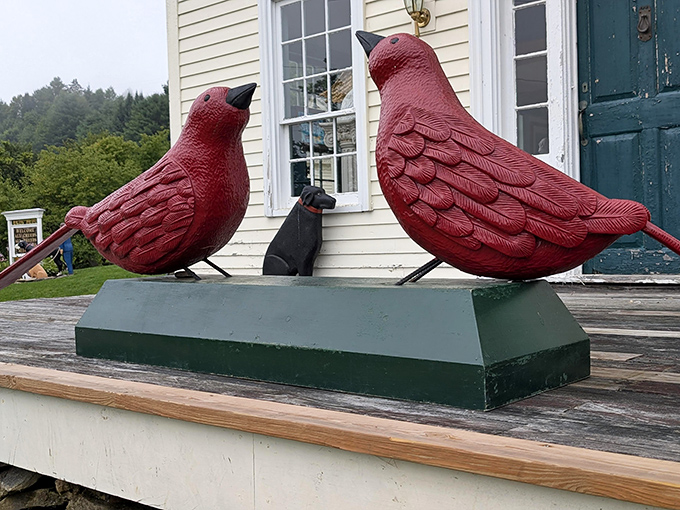 Not just dogs get the artistic treatment here – these cardinal sculptures demonstrate how all creatures find representation in this celebration of animal companionship.