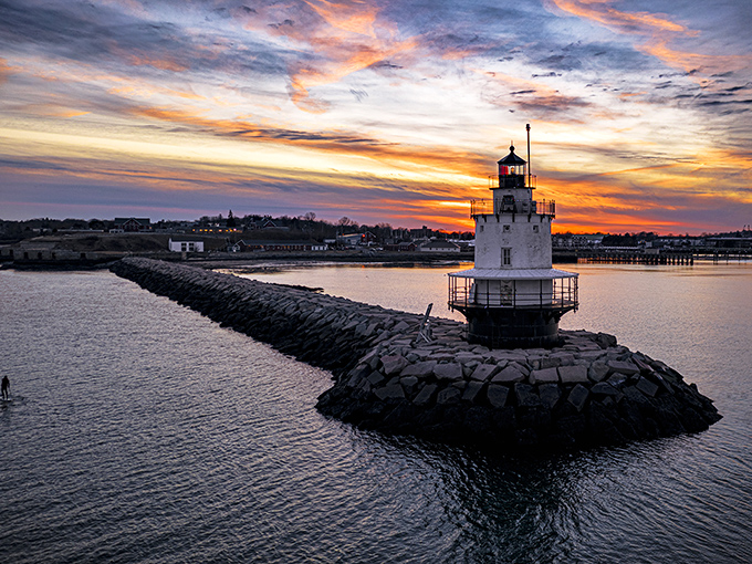 From above, the lighthouse resembles a chess piece strategically placed at the harbor entrance, guarding Portland's maritime gateway.