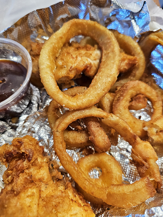 Golden calamari rings fried to perfection &ndash; crispy exterior giving way to tender seafood, proving Charlie's isn't just a one-trick barbecue pony.