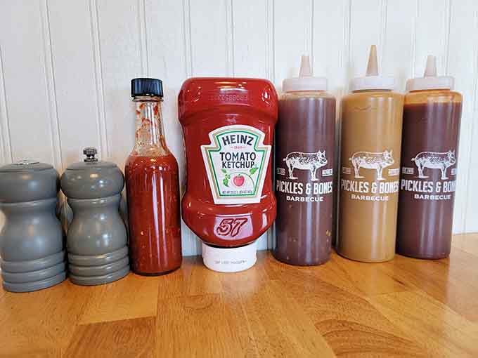 A proper barbecue joint offers options, from tangy to sweet, letting you customize your meal like a smoky choose-your-own-adventure.