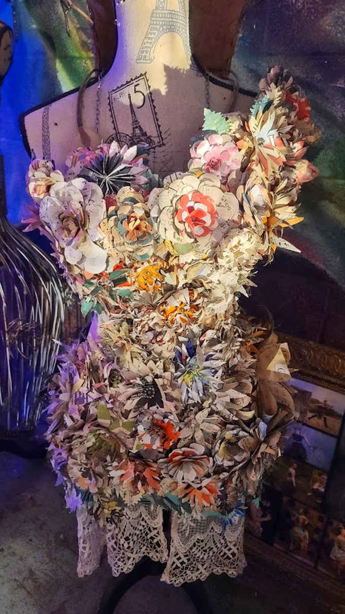 This paper flower dress stands as a rare delicate piece among the metalwork, showing the artist's range beyond nuts and bolts.