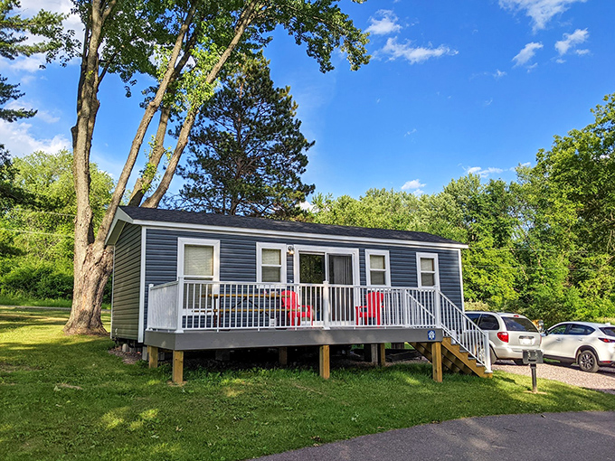 Modern cabin accommodations prove "roughing it" can include solid walls, real beds, and a charming front porch for morning coffee.