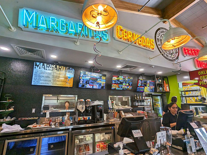 Where the magic begins – neon signs glow above efficient staff ready to take your order and start your journey into Mexican food bliss.