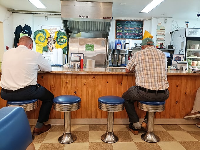 The counter seating offers front-row views to the culinary magic &ndash; where locals have been perching on these blue stools for generations.