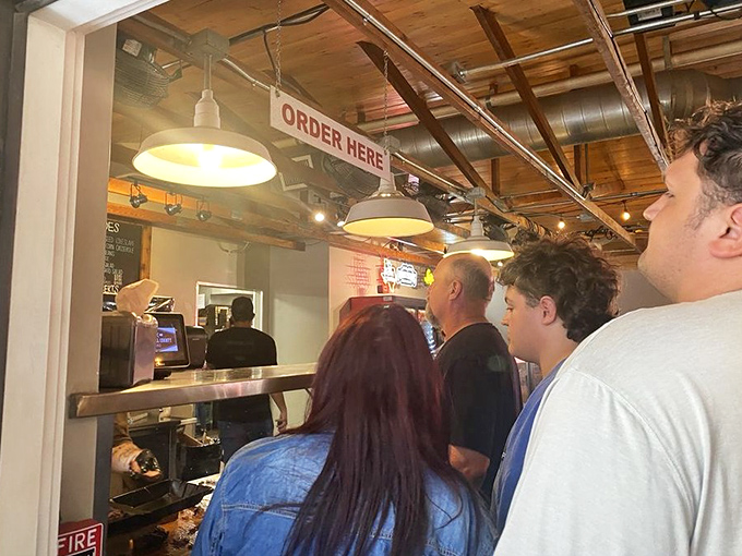 The line forms with purpose &ndash; these patrons know that good things come to those who wait, especially when those good things involve smoked meat.