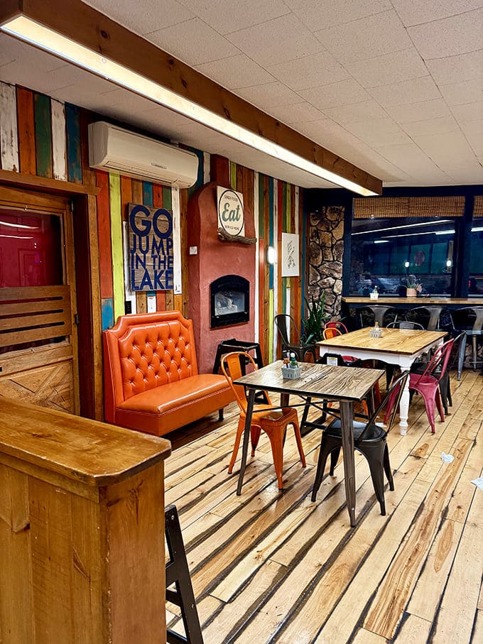 Multicolored walls, an orange leather booth, and wooden tables create a space that feels like a 1970s rec room redesigned by a food-loving artist.