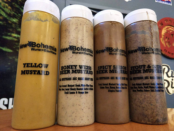 The mustard lineup at New Bohemia isn't just condiments&mdash;it's a flavor spectrum ranging from classic yellow to adventurous beer-infused varieties.