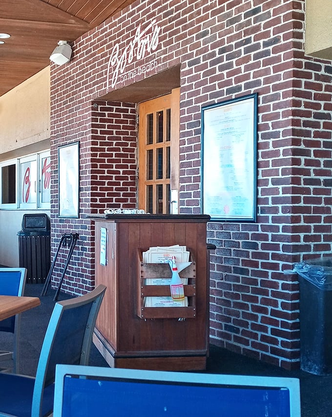 The hostess stand welcomes hungry patrons, a gateway to the Boston-inspired culinary adventure that awaits inside.