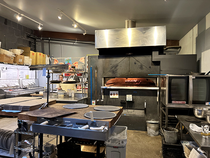 Folino&rsquo;s bustling kitchen centers around the wood-fired oven, where every pizza begins its delicious journey.