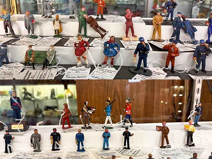 Miniature figures standing at attention like the world's smallest but most detailed army, each one a tiny masterpiece of craftsmanship.