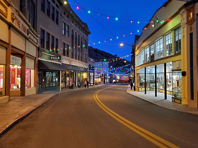 Evening transforms Bisbee into a magical wonderland of twinkling lights, where the night air carries music and laughter from establishments that have served generations.