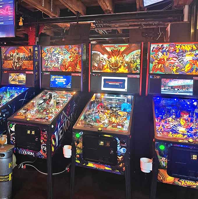 Classic pinball machines lined up like old friends waiting to test your reflexes and drain your virtual balls with gleeful abandon.