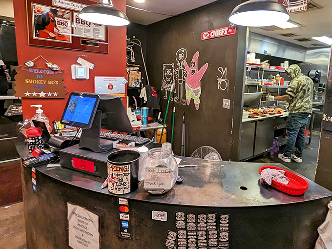 The ordering counter, where barbecue dreams come true, complete with hand-drawn characters that add personality to the experience.
