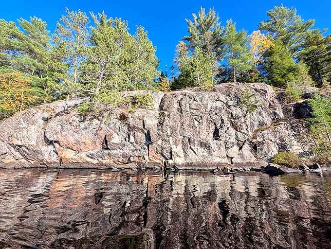 Dramatic rock formations meet crystal waters in a geological handshake that's been millions of years in the making.