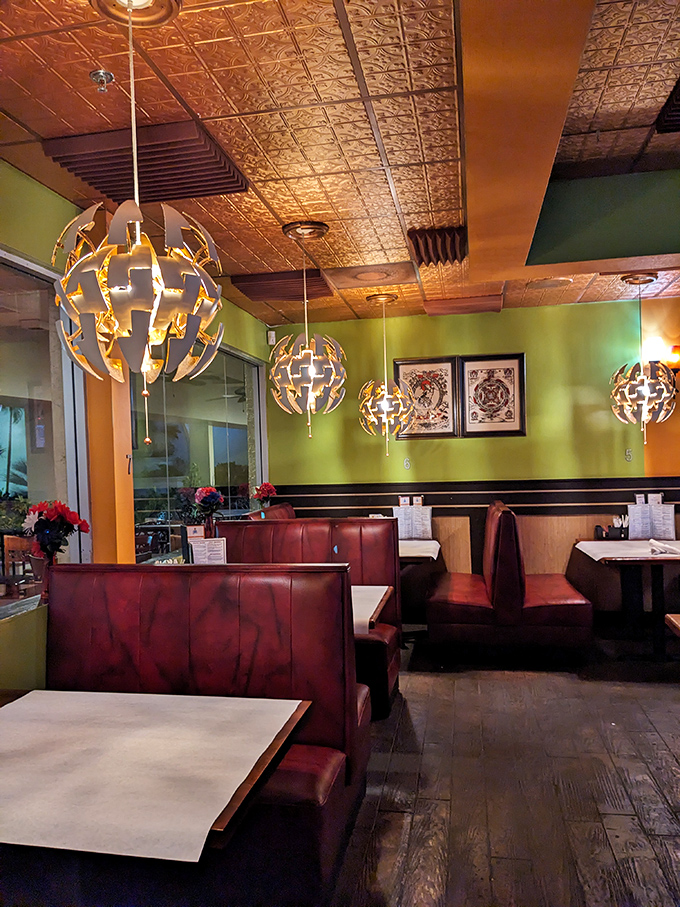 Burgundy booths invite you to settle in for a flavor journey &ndash; comfortable enough for the food coma that inevitably follows.