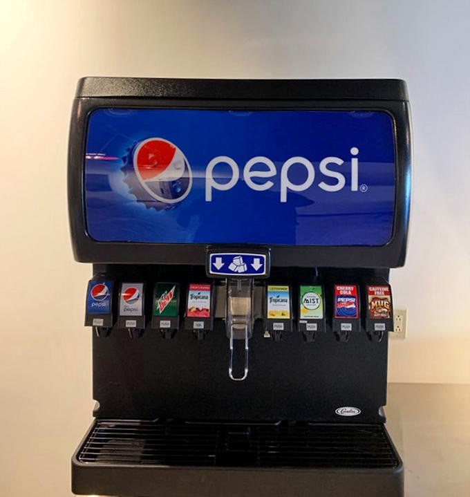 The soda fountain stands ready to provide the sweet, cold counterpoint to all that savory, smoky goodness on your plate.