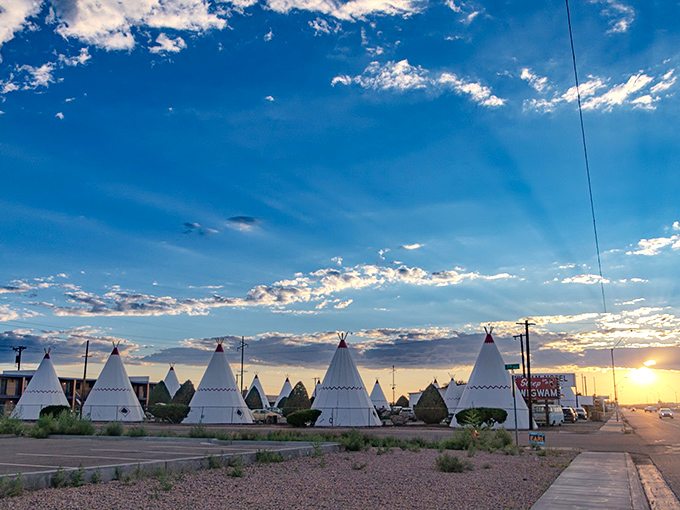 Sunset transforms the Wigwam Motel into a silhouetted wonderland, the perfect backdrop for end-of-day reflection on America's Mother Road.