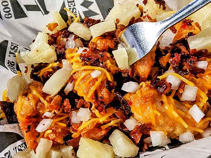 Loaded tater tots that require both a fork and a commitment &ndash; worth every delicious, messy bite.