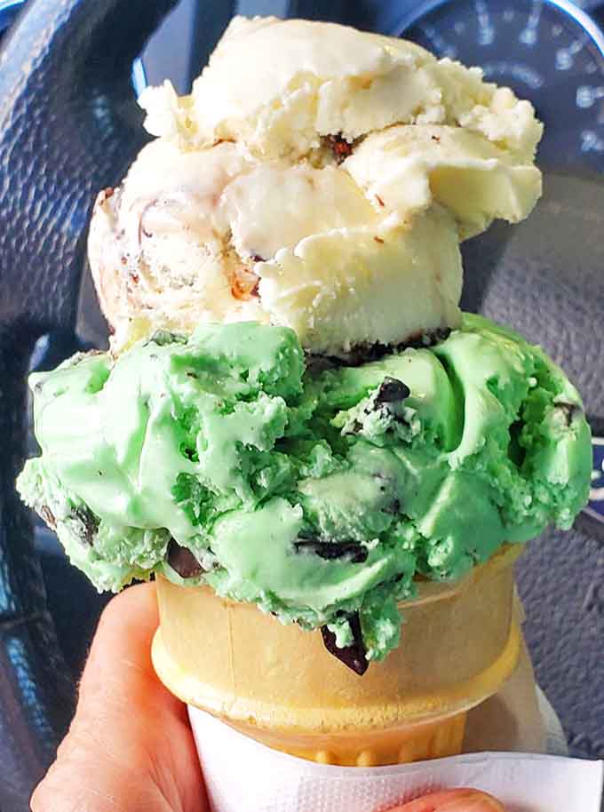 Mint chocolate chip and vanilla ice cream stacked high in a waffle cone &ndash; summer's perfect accessory for sticky fingers and happy hearts.