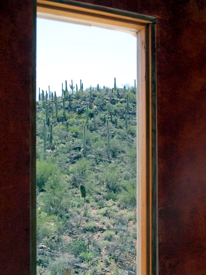 Every window frames a different desert masterpiece &ndash; saguaros stand like sentinels guarding the castle's domain.