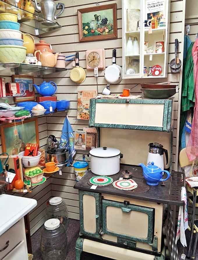 This vintage kitchen display isn't just selling items &ndash; it's selling the warm memory of grandma's house, complete with colorful Pyrex and retro appliances.