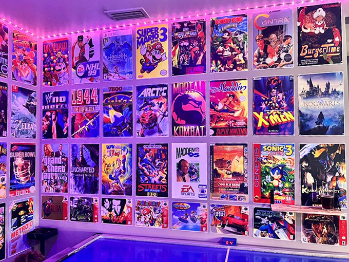 The walls serve as a museum of gaming art, with vibrant box covers showcasing everything from fighting games to fantasy adventures.