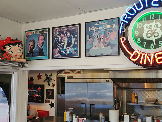 The walls tell stories through album covers and movie posters, creating a visual soundtrack for your meal that spans decades of American pop culture.