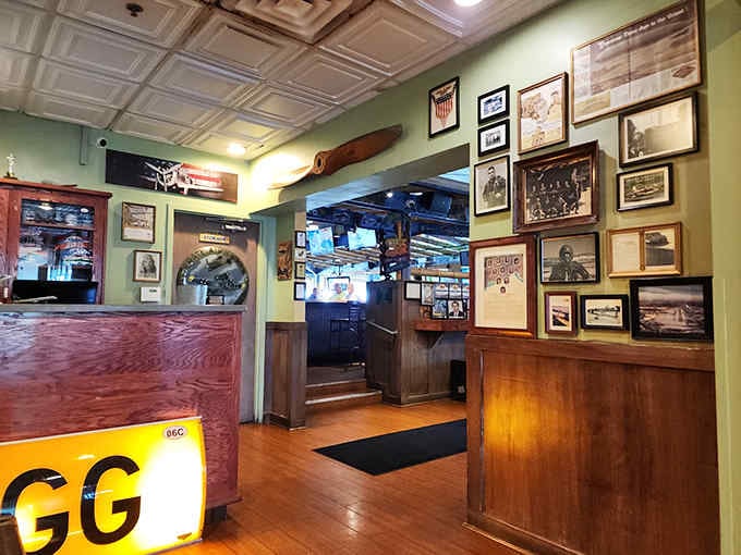 The restaurant's interior celebrates flight with authentic aviation artifacts, airplane models, and panoramic murals that surround diners in flying history.