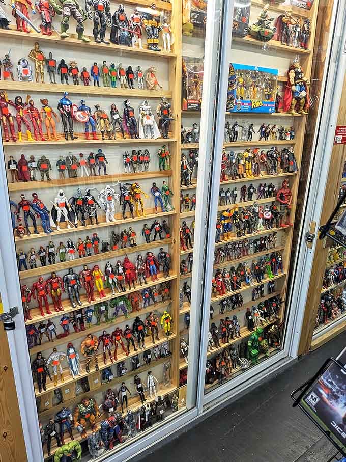 A museum-worthy collection of superheroes and action stars stands at attention behind glass, an army of plastic nostalgia awaiting marching orders.