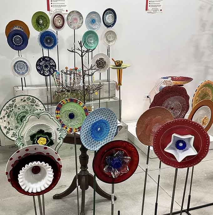 Colorful vintage plates transformed into garden art, proving that creativity finds beauty in the most unexpected places.